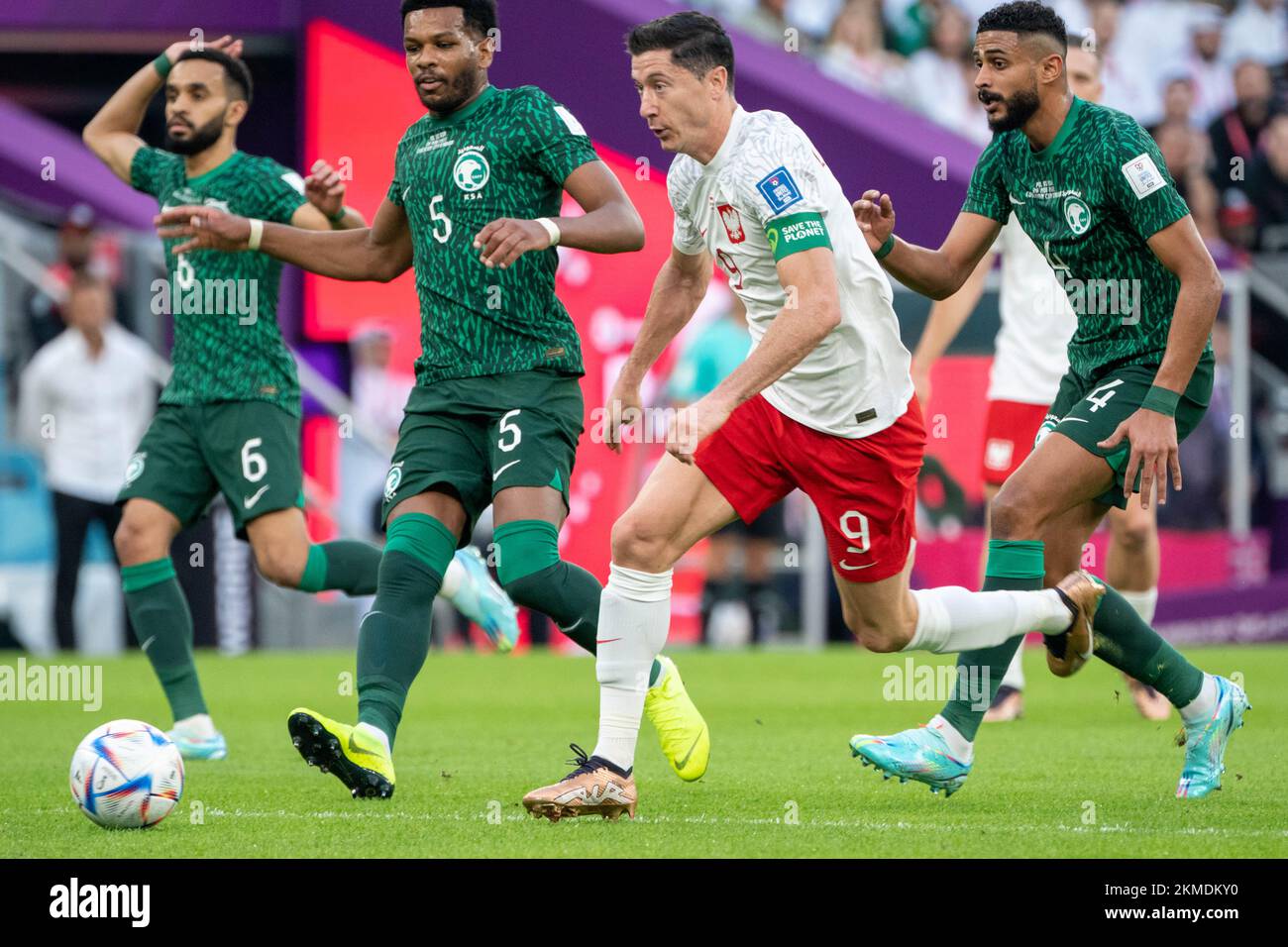 Robert Lewandowski of Poland in action with ABDULELAH ALAMRI of Saudi ...