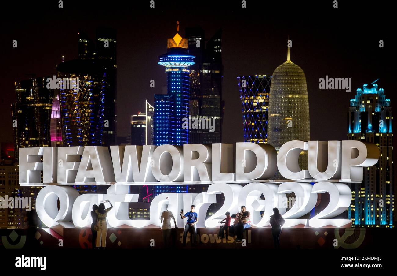 DOHA - Football supporters at the logo of the FIFA World Cup Qatar 2022 ...