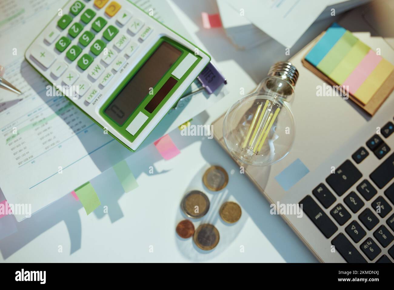 calculator, lamp, coins and documents on the desk in office Stock Photo ...