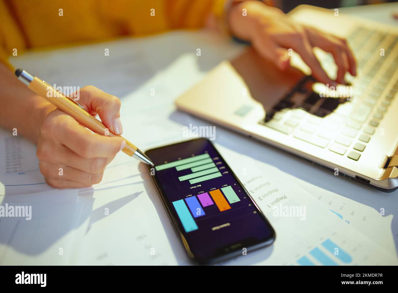 Closeup on middle aged small business owner woman with smartphone and ...