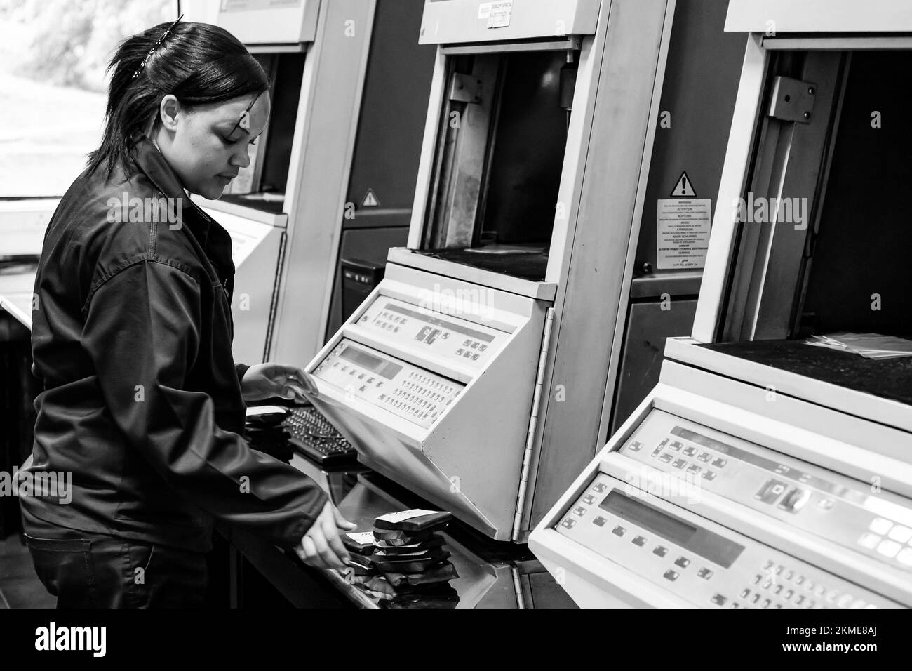 A closeup of a female lab technician testing product samples in a ...