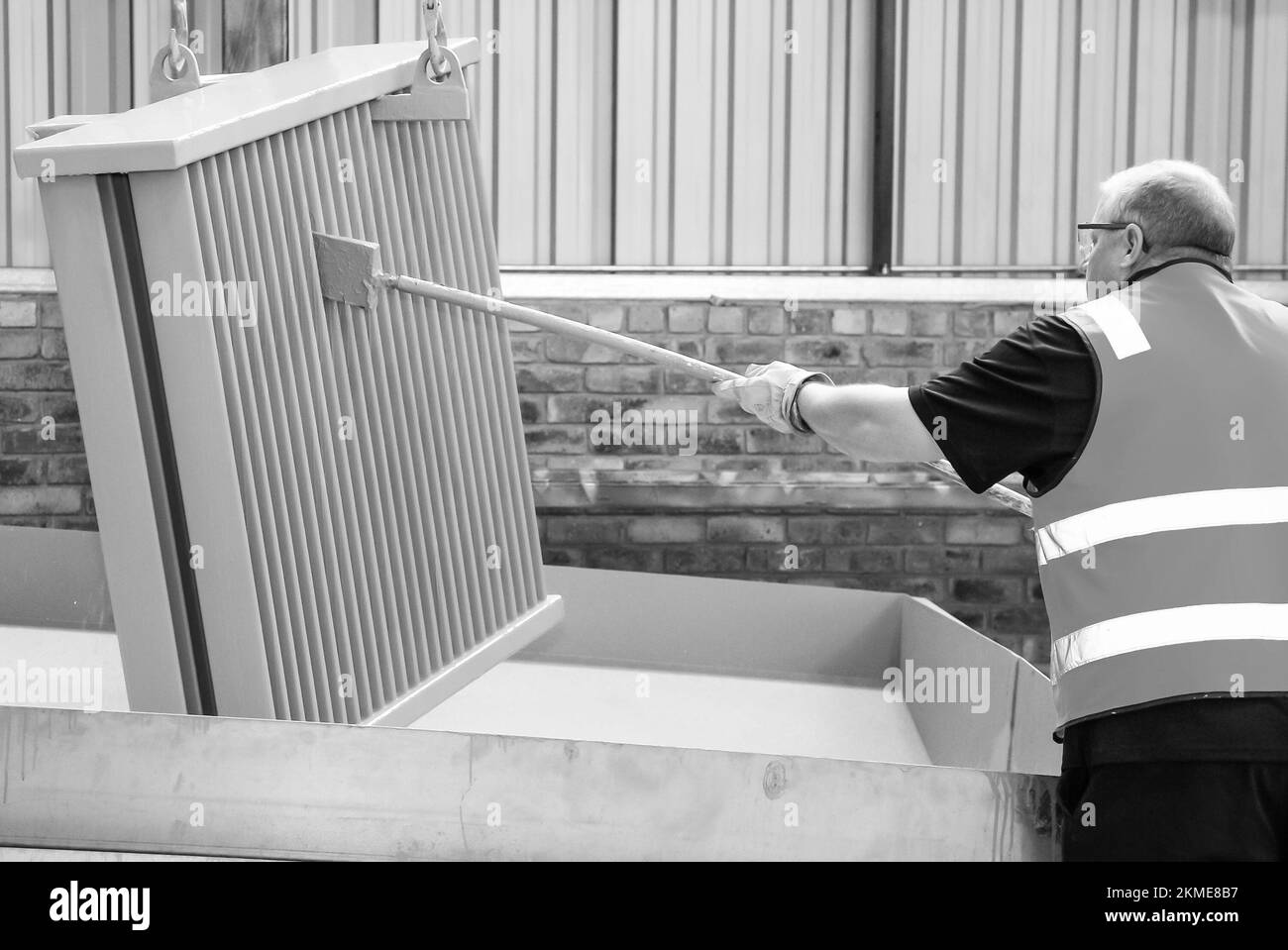 A closeup of a worker inside a Transformer Manufacturing Factory ...