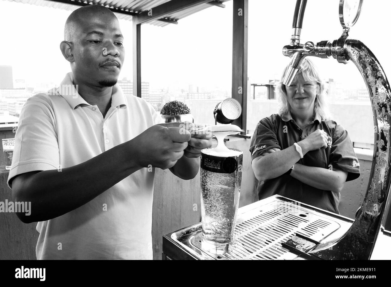 Pouring beer Black and White Stock Photos & Images - Alamy