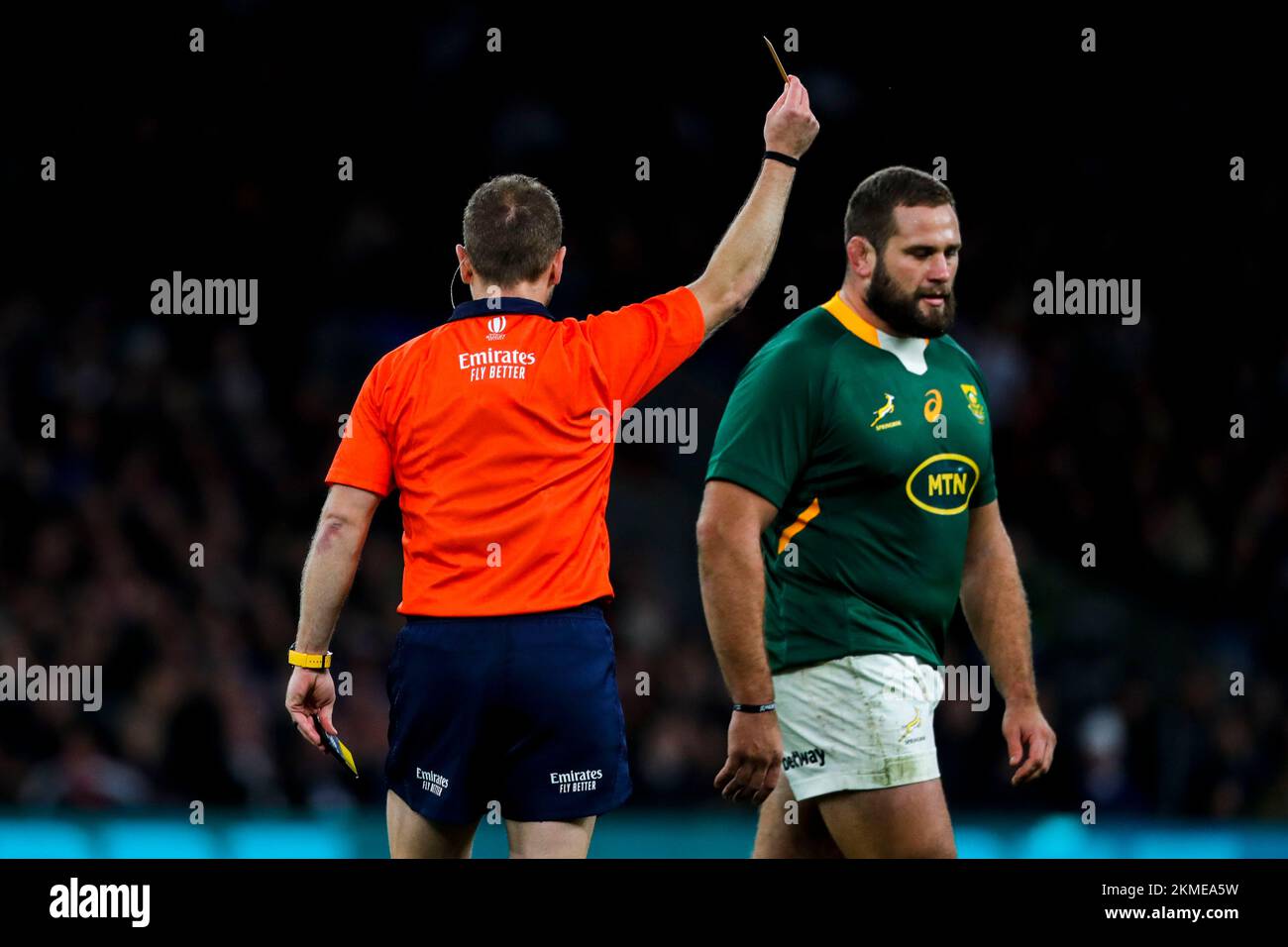Referee Angus Gardner shows a red card to South Africa's Thomas du Toit ...