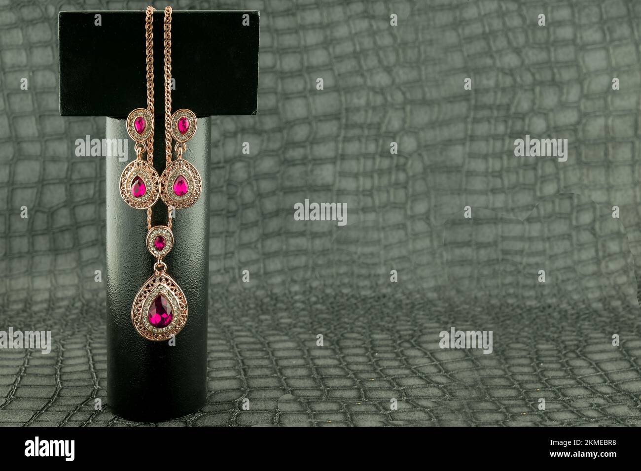 Photo of golden set with gems over dark background Stock Photo - Alamy