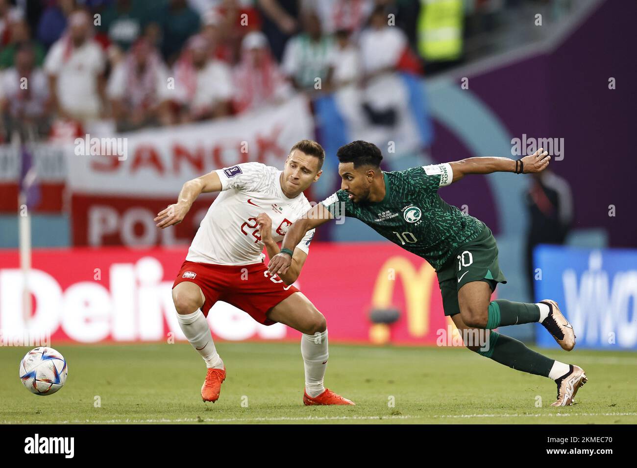 DOHA - (LR) Przemyslaw Frankowski of Poland, Salem Al-Dawsari of Saudi Arabia during the FIFA ...