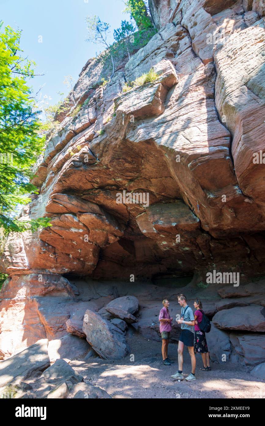 Vosges (Vogesen) Mountains: cave Grotte du Brotsch, hiker in Alsace ...