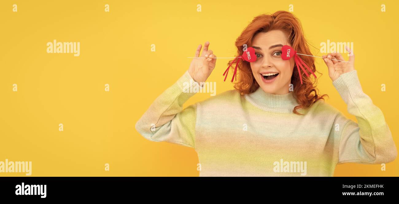 glad funny redhead girl with red heart sticks on yellow background ...