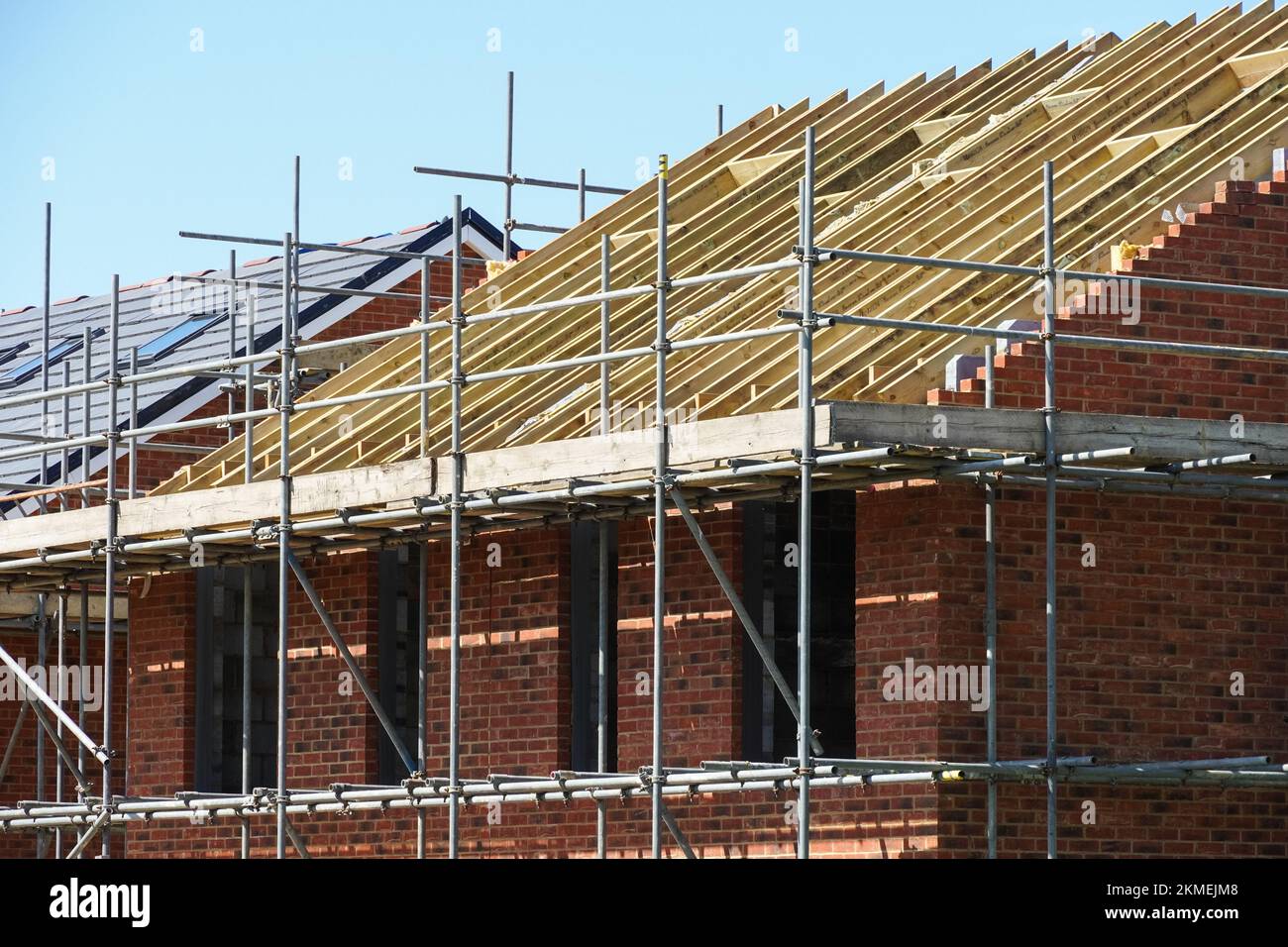 New roof construction at housebuilding site, timber structure of a new ...
