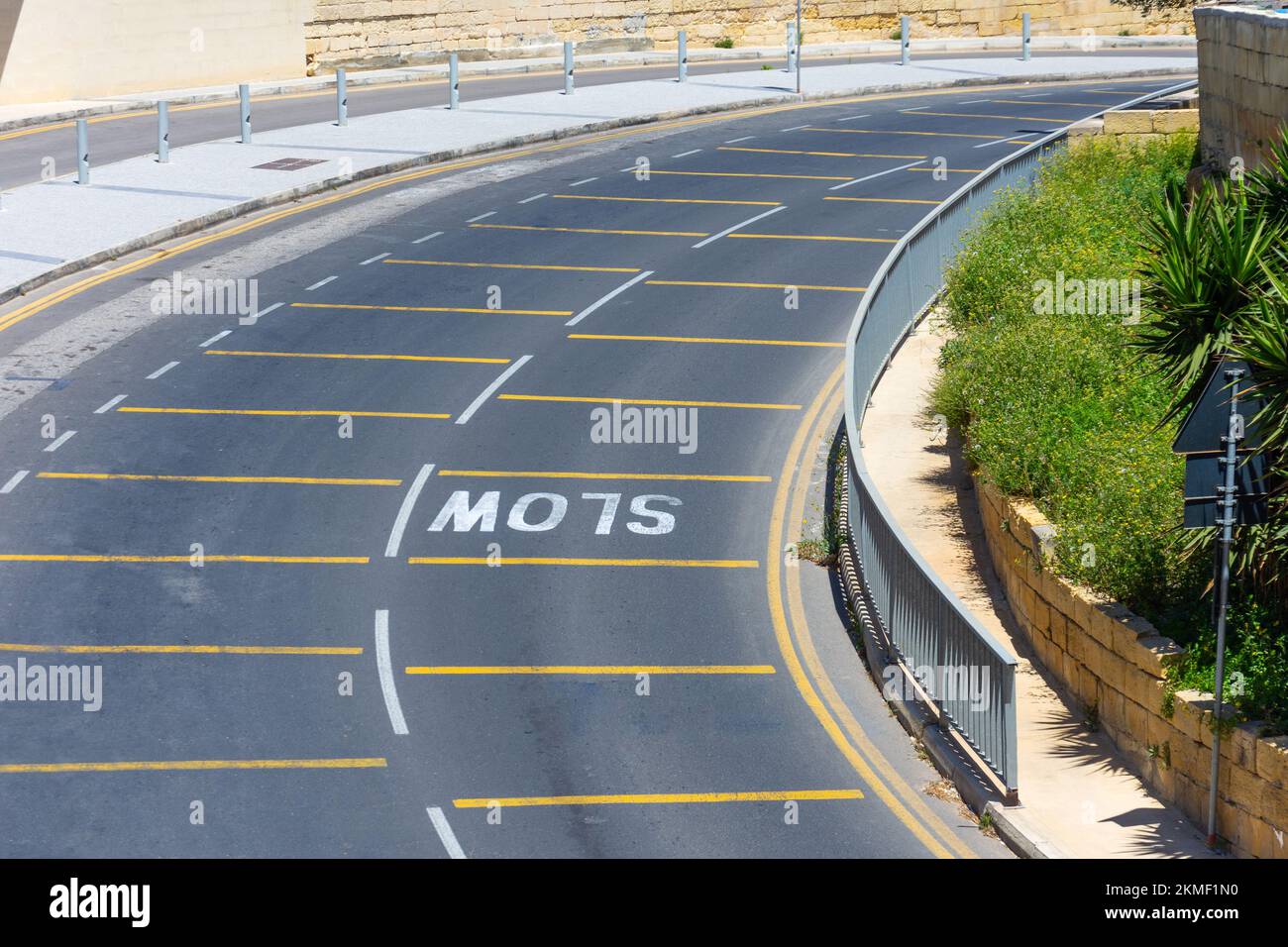 Sharp turn with strip markings in the city with left side traffic ...