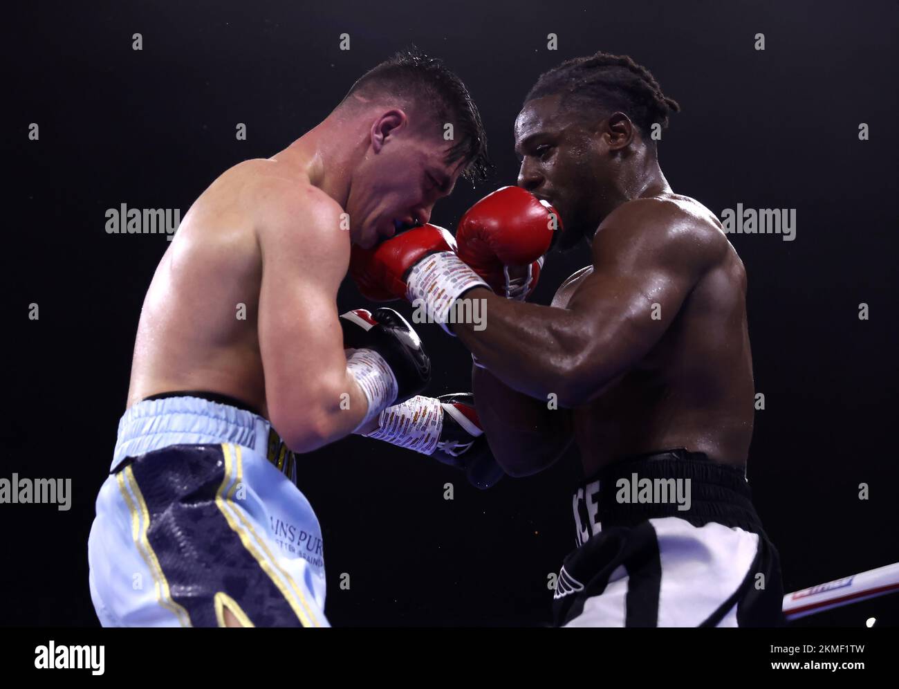 Mark Dickinson (left) and Gideon Onyenani in the middle weight bout at ...