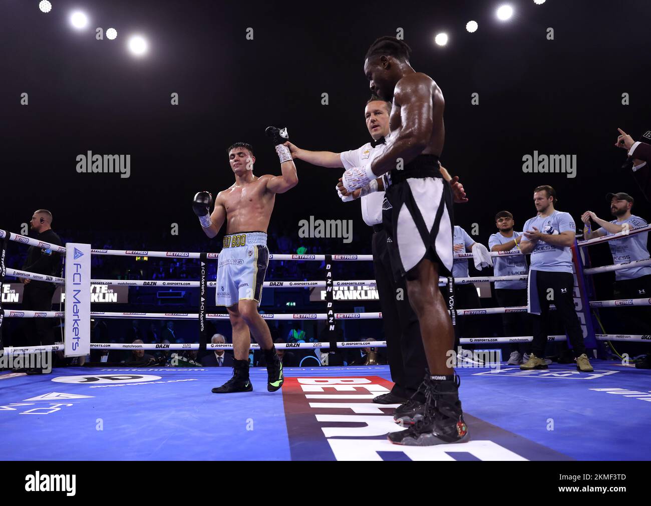 Mark Dickinson (left) celebrates victory against Gideon Onyenani in the ...