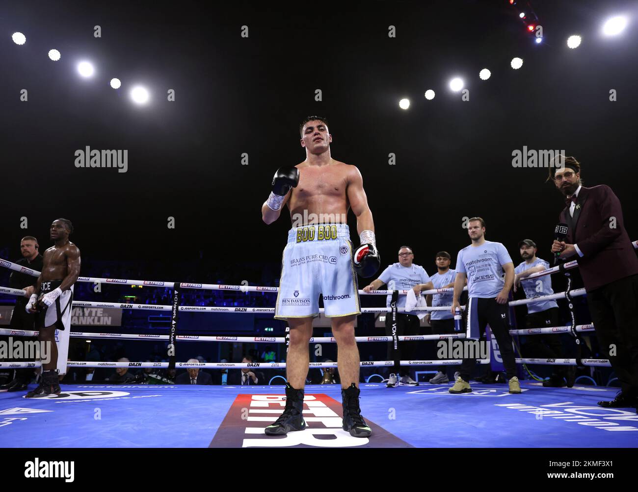 Mark Dickinson celebrates victory against Gideon Onyenani in the middle ...