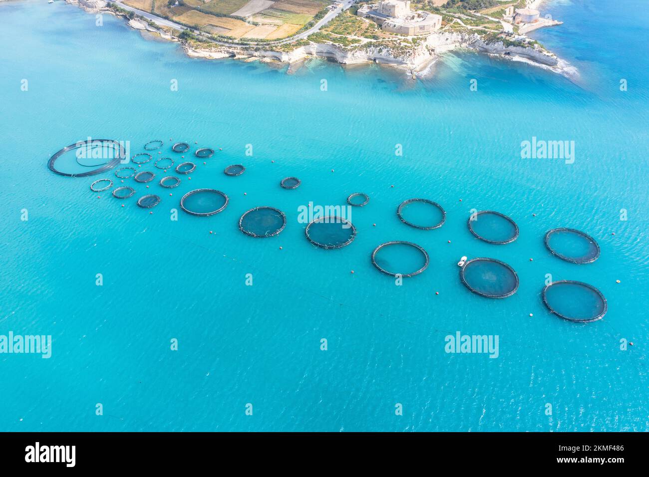 Aerial view fish farm with floating cages in the Mediterranean sea ...