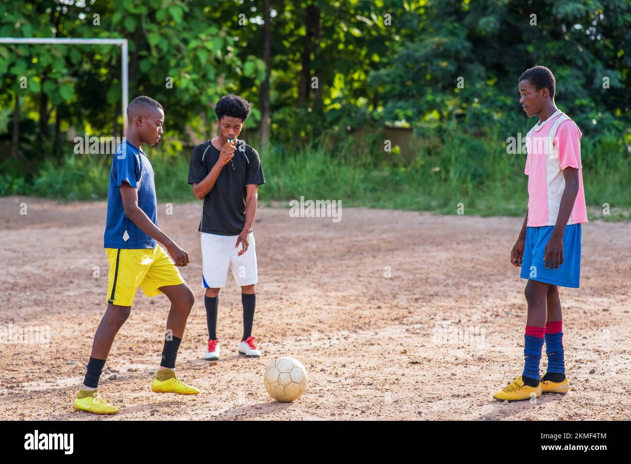 African teenagers playing football in the open air Stock Photo - Alamy