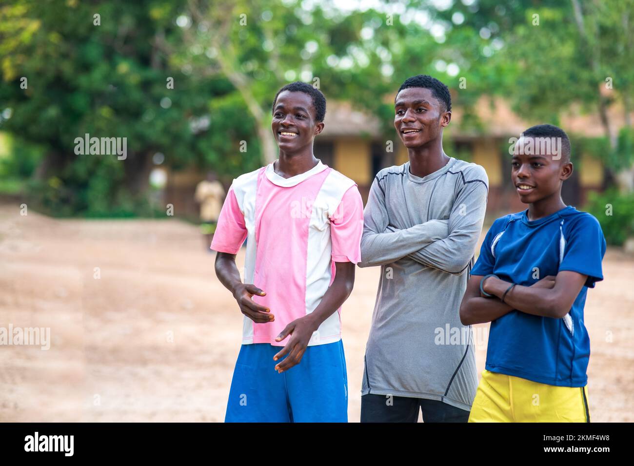 Happy African teenagers celebrating victory on soccer field Stock Photo ...