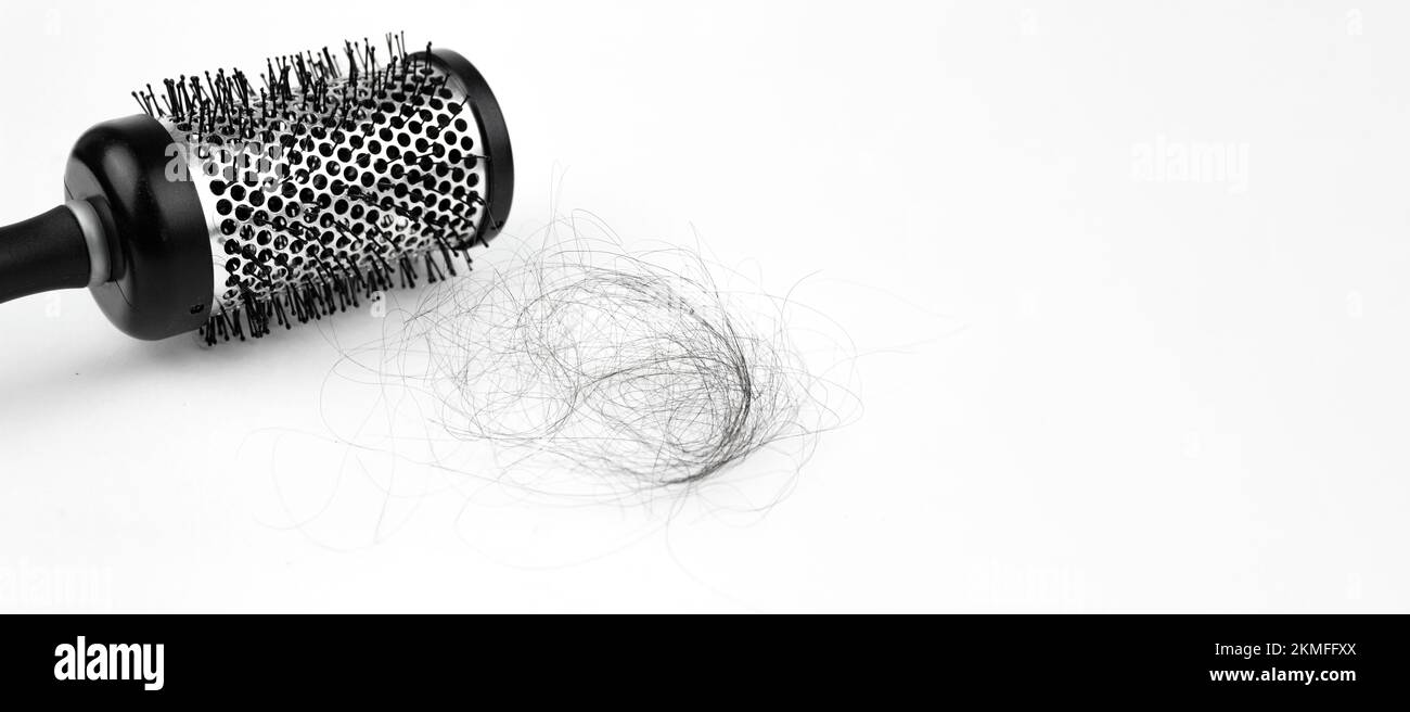 Woman hair loss problem with round hair brush, on white background ...