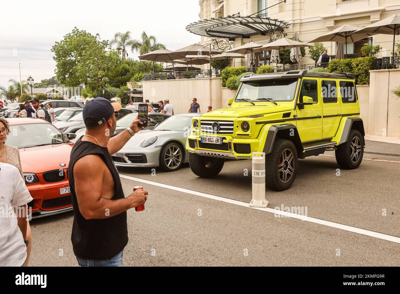 Bright,coloured,Hummer,Jeep,style,vehicle,car,parked,front,of,luxury ...
