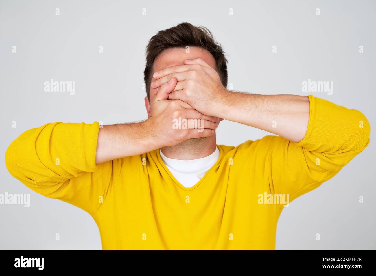 Anonymous caucasian man hiding his identity . Studio shot Stock Photo ...