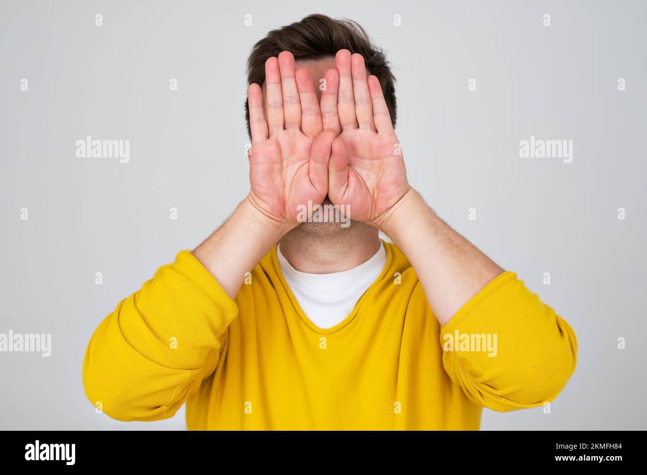 Anonymous caucasian man hiding his identity . Studio shot Stock Photo ...