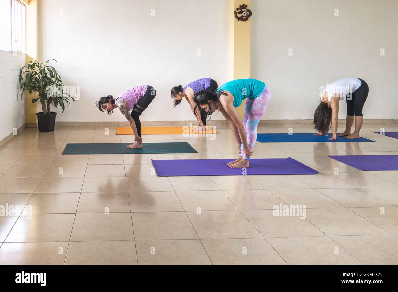 Yoga class women doing stretching hi-res stock photography and images ...