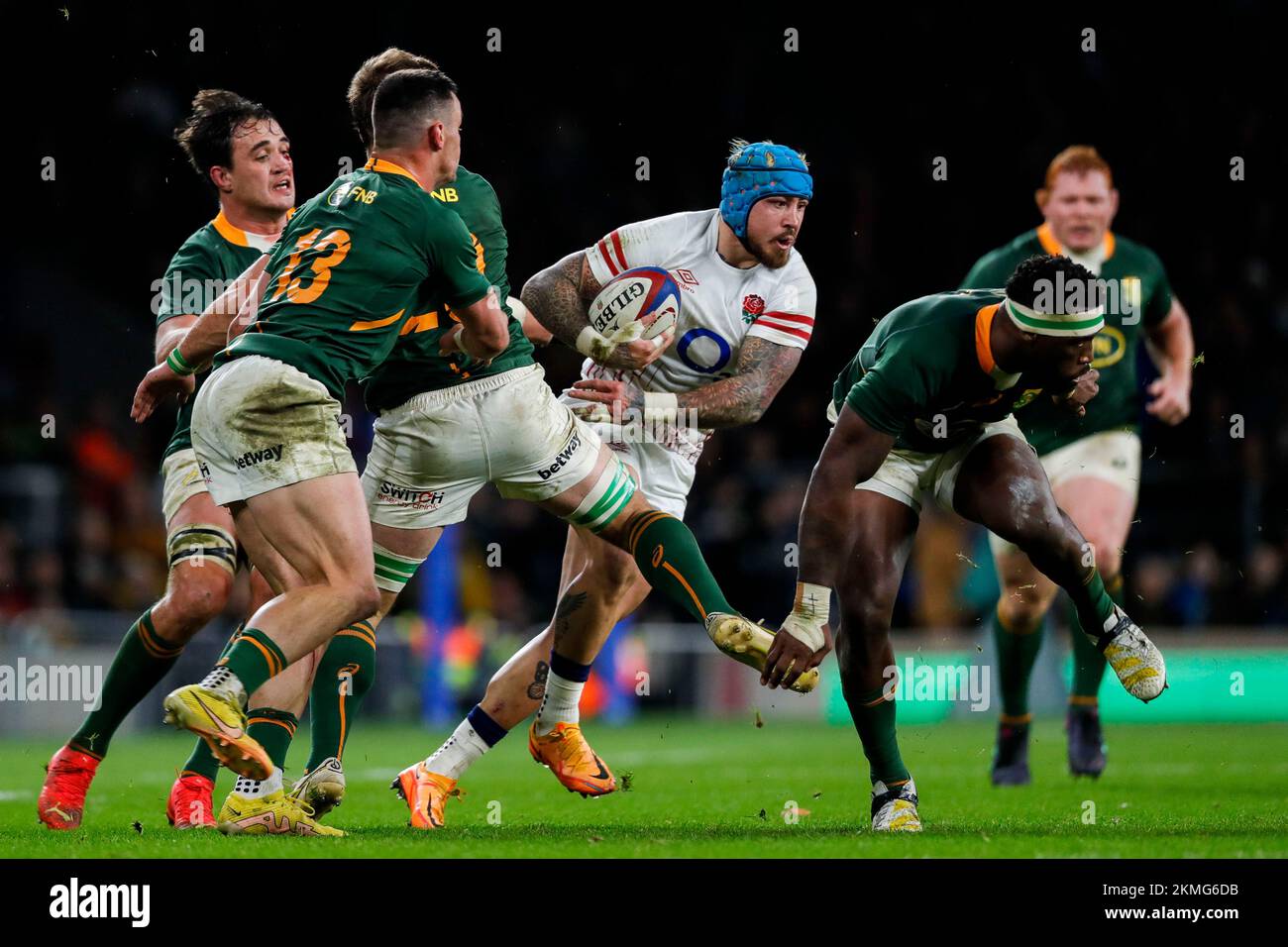 England's Jack Nowell (centre) with South Africa's Franco Mostert (left ...