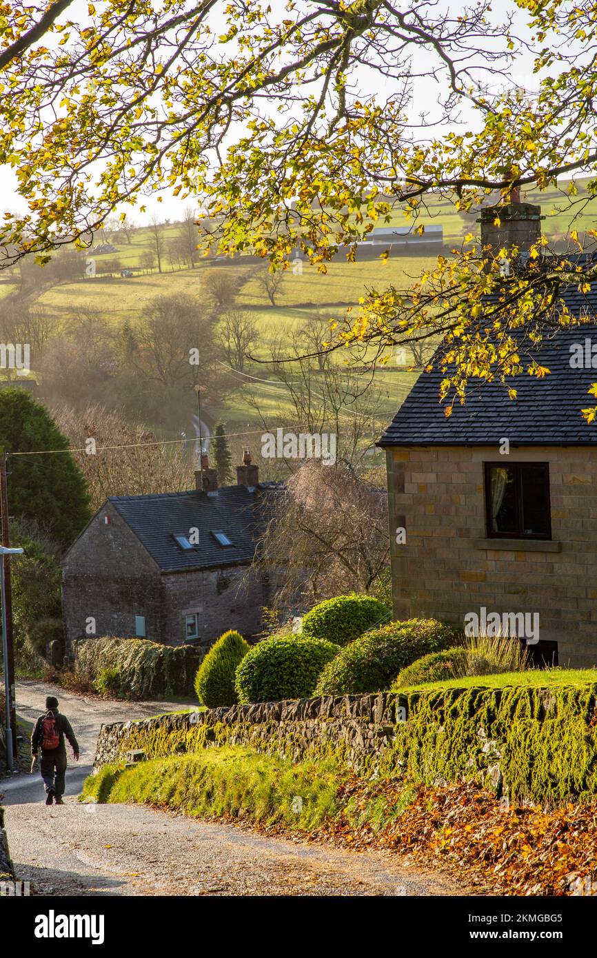 Man walking through the North Staffordshire Peak District village of ...