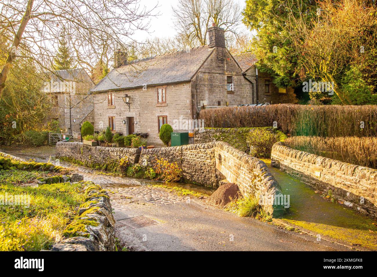Hoo Brook flowing through the ford over the cobbled main street in the ...