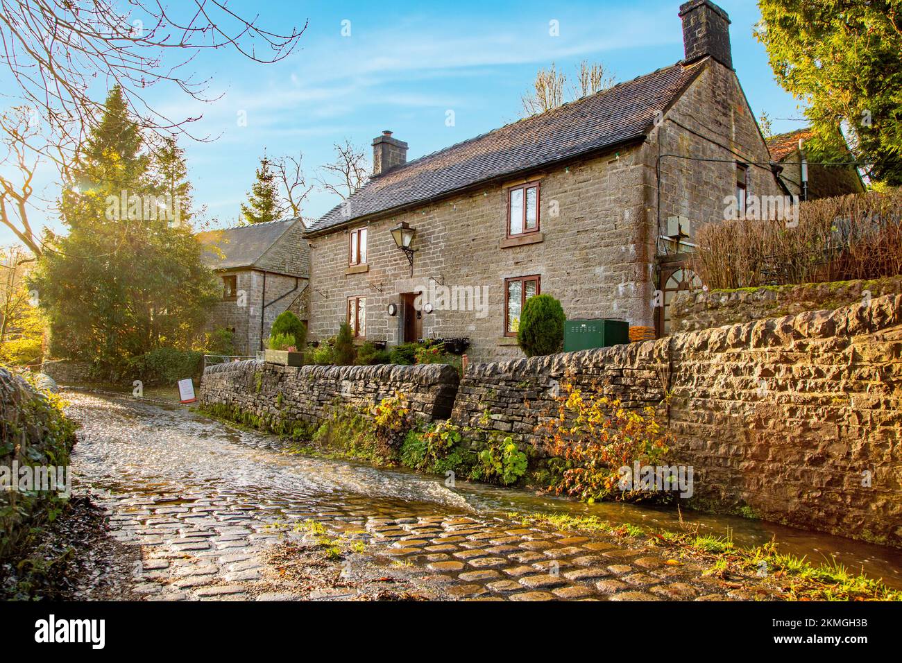 Hoo Brook flowing through the ford over the cobbled main street in the ...