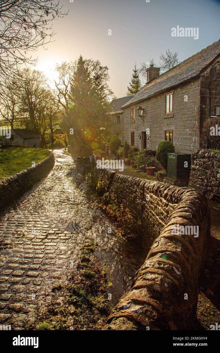 Hoo Brook flowing through the ford over the cobbled main street in the ...