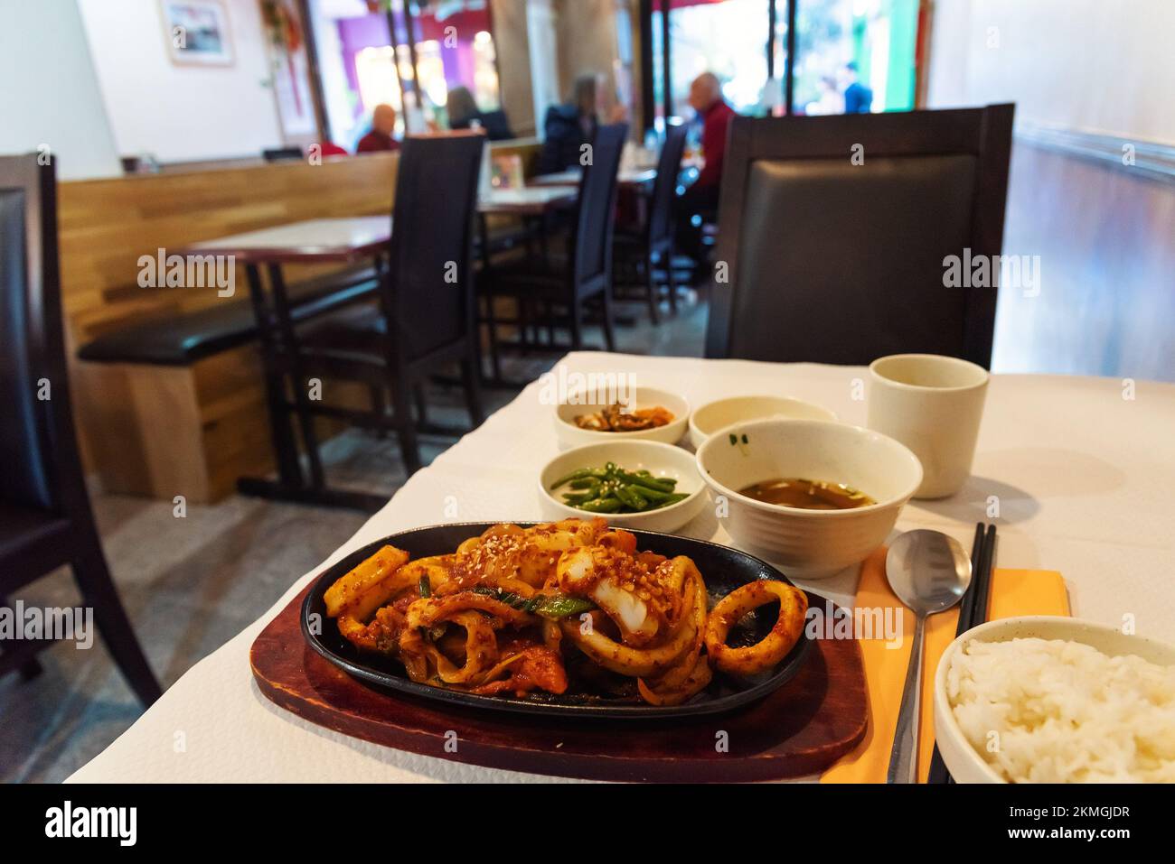 Fried squid and soup, rice, kimchi and vegetables as side dishes in ...