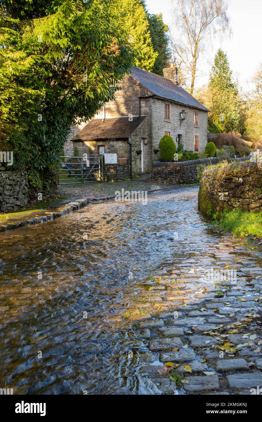 Hoo Brook flowing through the ford over the cobbled main street in the ...