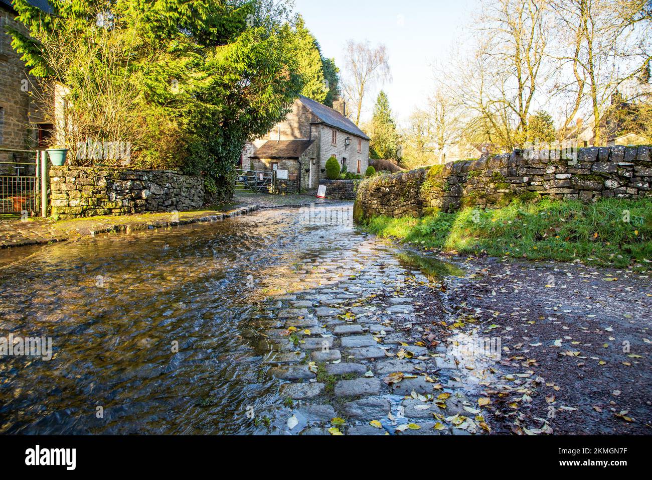 Hoo Brook flowing through the ford over the cobbled main street in the ...