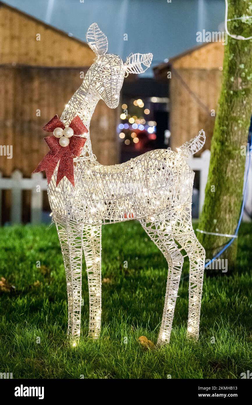 A closeup of a decorative deer made of lights in a garden Stock Photo ...