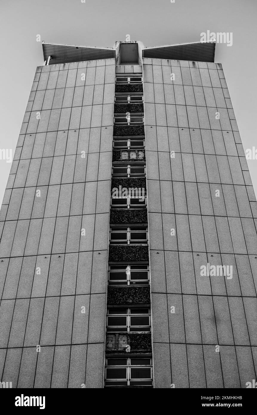 A tall concrete building in grayscale Stock Photo - Alamy