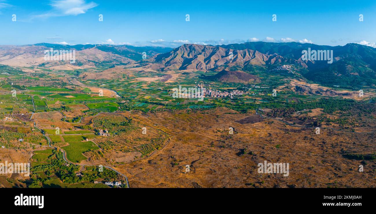 Sicilian vineyards with Etna volcano eruption at background in Sicily ...