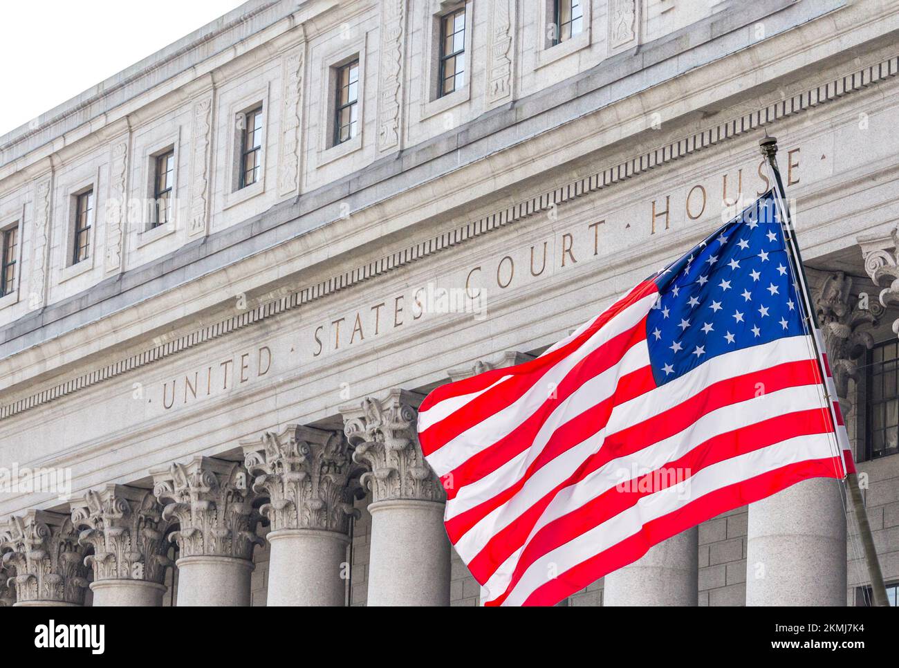 USA national flag waving in the wind in front of United States Court ...