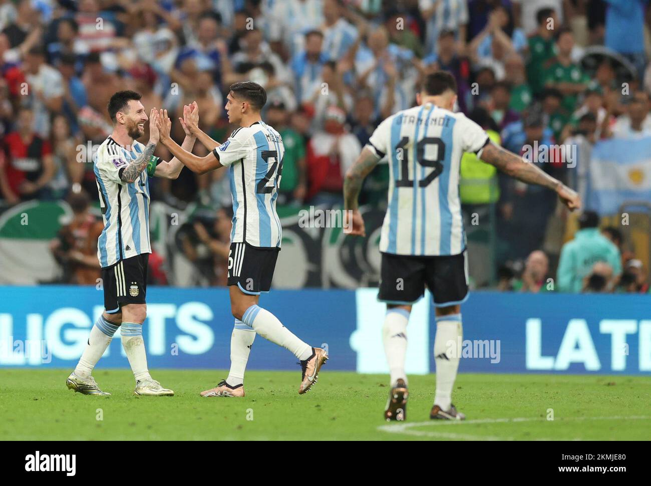 Lusail, Qatar. 26th Nov, 2022. Lionel Messi (L), Nahuel Molina (C) of ...