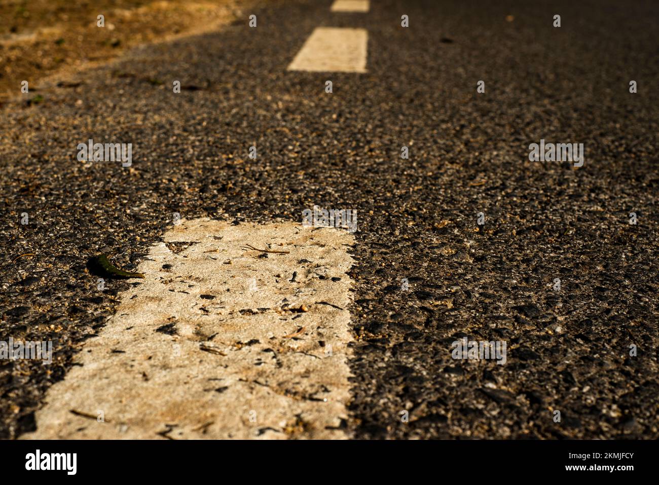 Asphalt texture detail with white line Stock Photo - Alamy