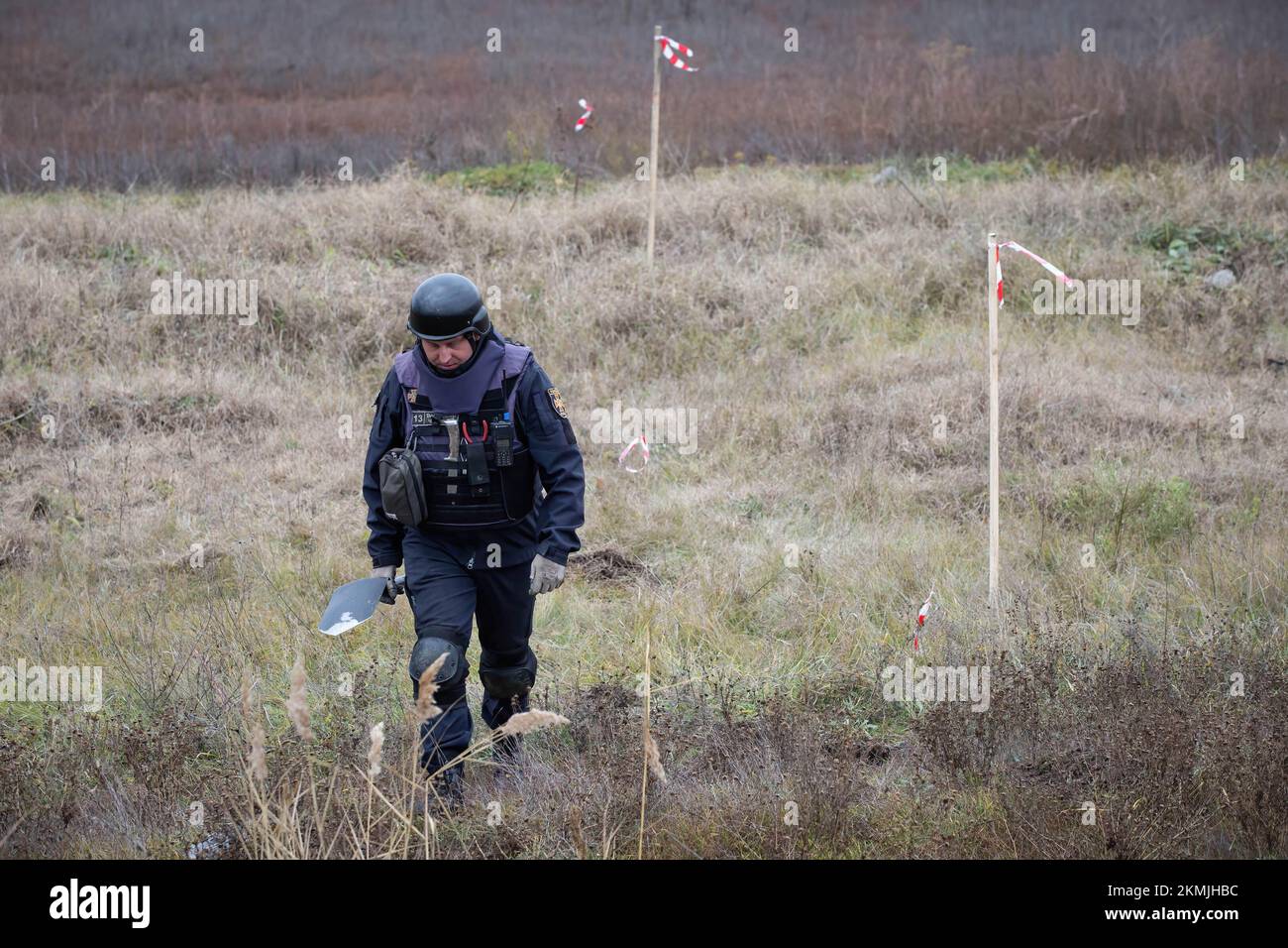 A Ukrainian sapper clears mines at the site of recent fighting between ...