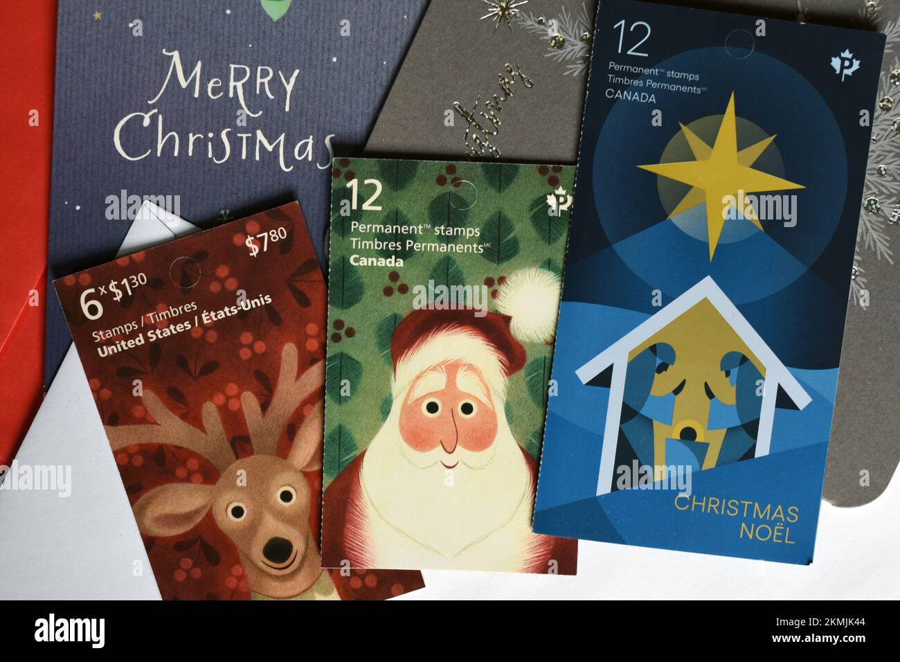 Canada Post Christmas themed postage stamps are pictured on top of ...