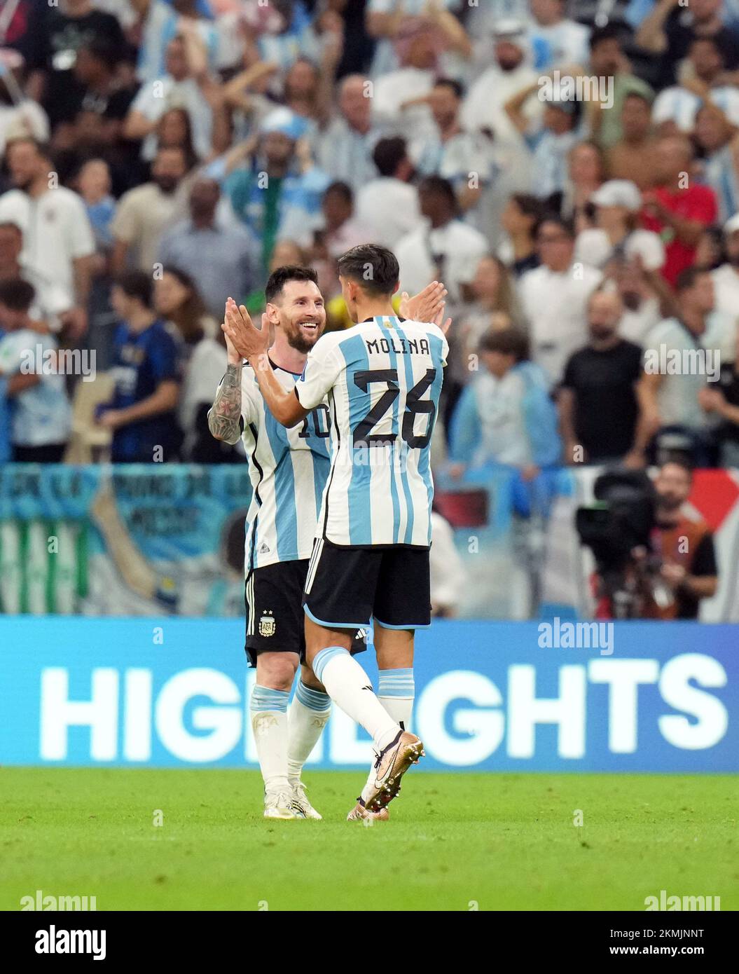 Argentina's Lionel Messi (left) and Nahuel Molina celebrate following ...