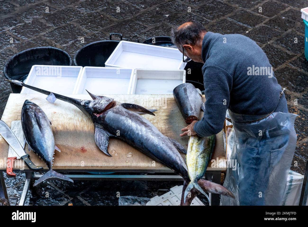 Preparing Fresh Fish At The Daily Fish Market, Catania, Sicily, Italy ...