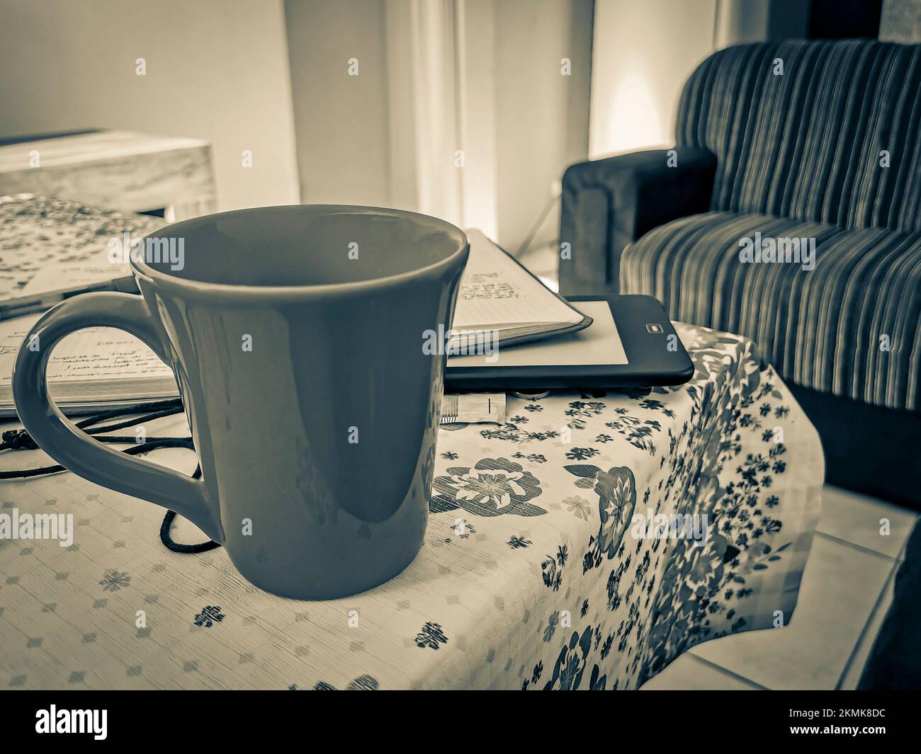 Old black and white picture of Red cup of coffee on grandmas table ...