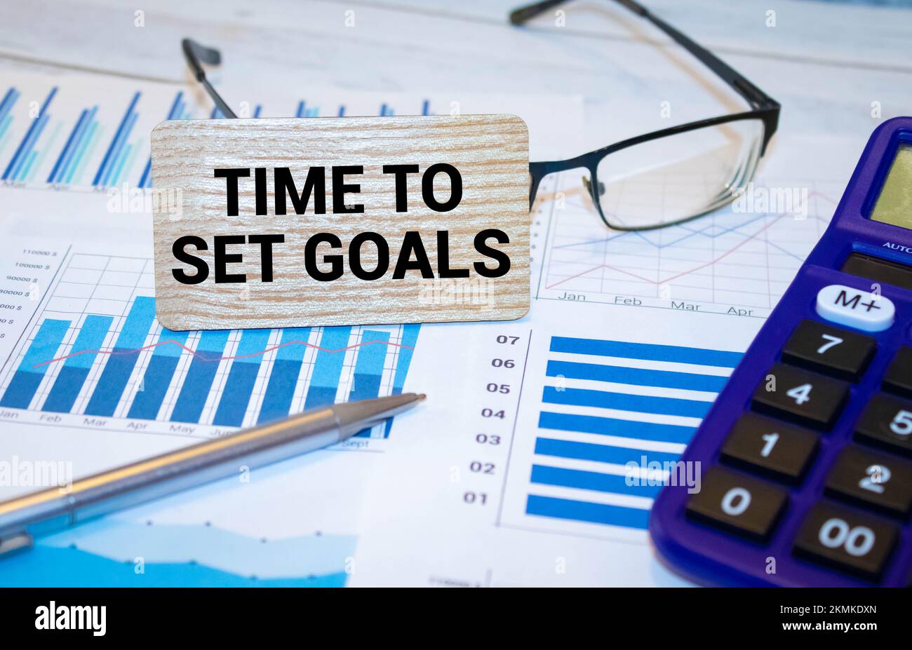 time to set goals. two notepads with text on a white background next to ...