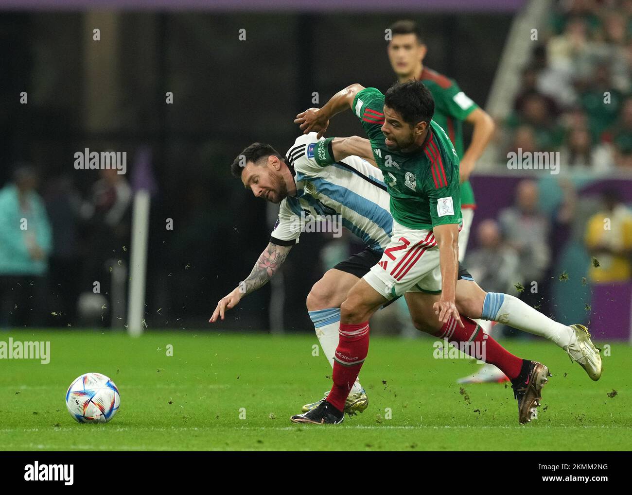 Argentina's Lionel Messi (left) and Mexico's Nestor Araujo battle for ...