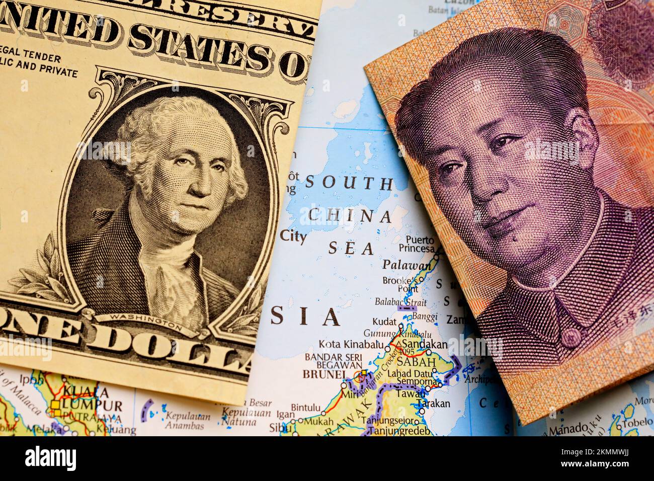 Close-up of a US dollar bill and a yuan Chinese banknote on top of a ...