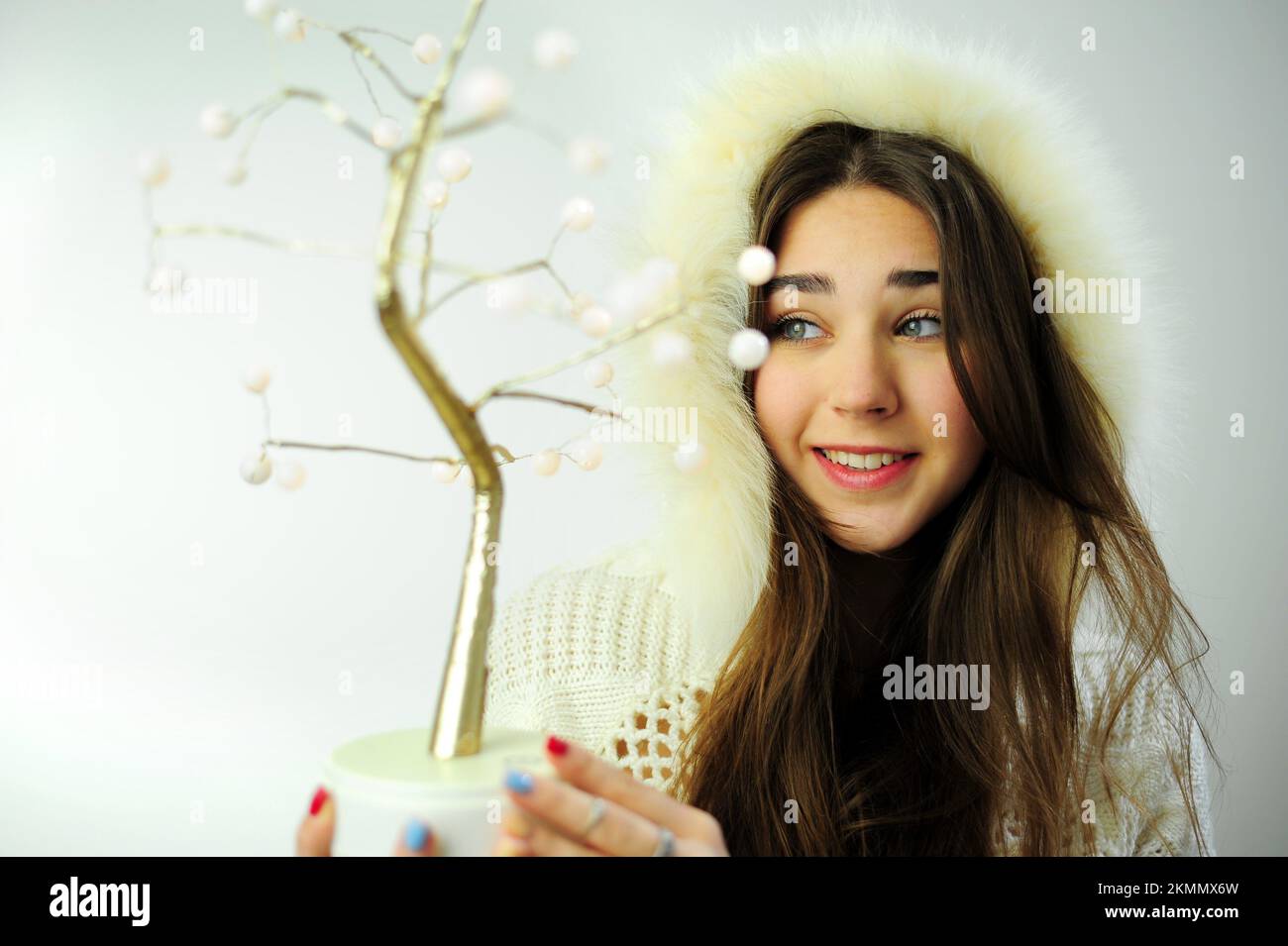 Christmas decoration The Snow Maiden holds in her hands the Japanese ...