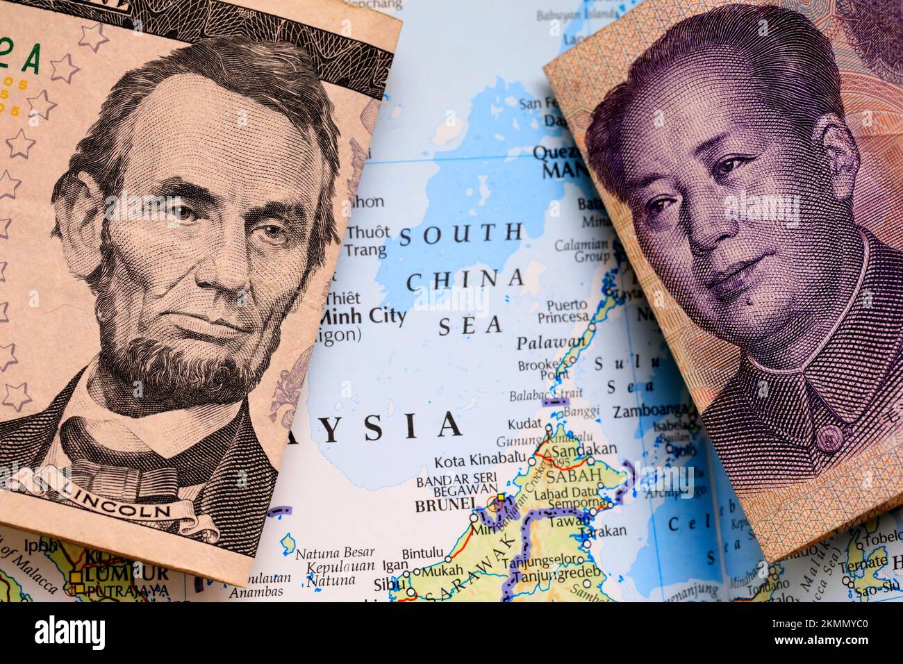 Close-up of a US dollar bill and a yuan Chinese banknote on top of a ...