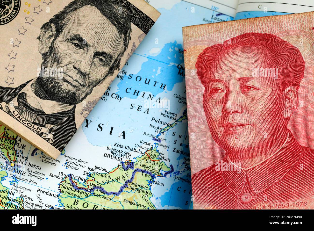 Close-up of a US dollar bill and a yuan Chinese banknote on top of a ...